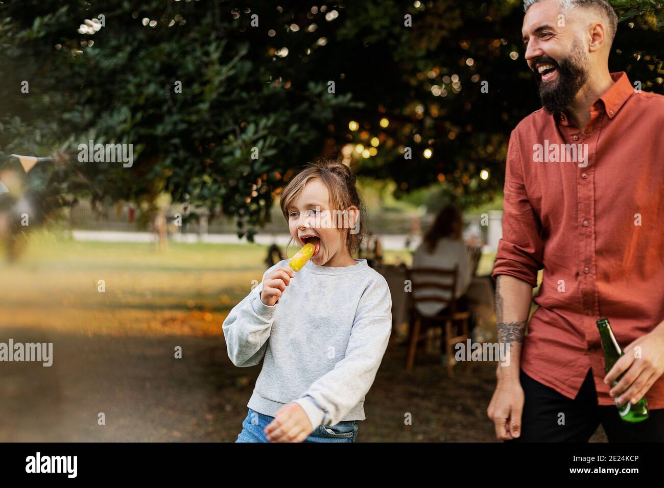 Girl having ice lolly Stock Photo - Alamy