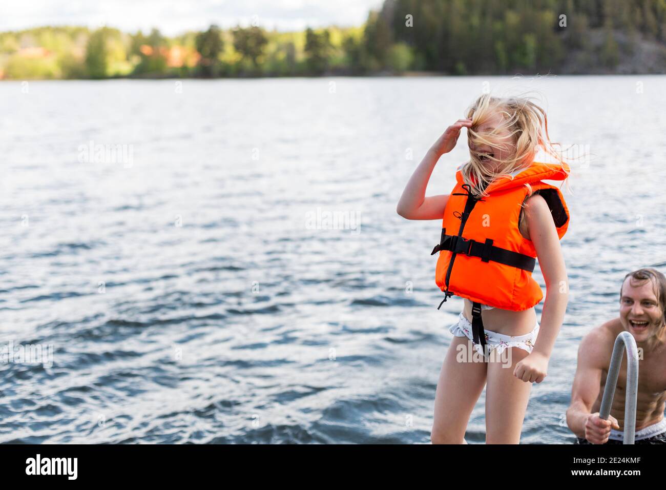 Happy girl at lake Stock Photo - Alamy