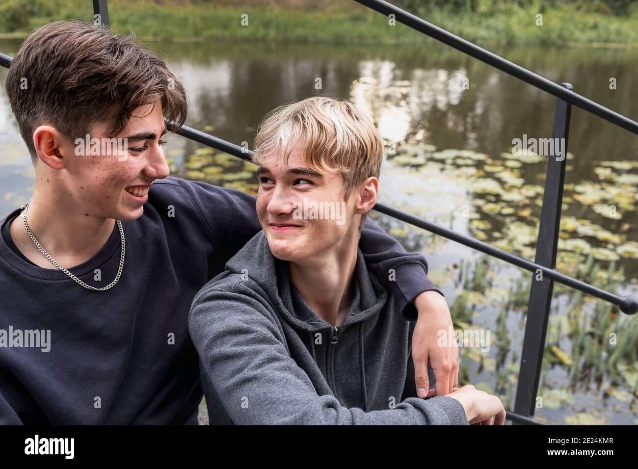 Two teenage boys sitting together Stock Photo - Alamy Two teenage boys sitting together Stock Photo - Alamy