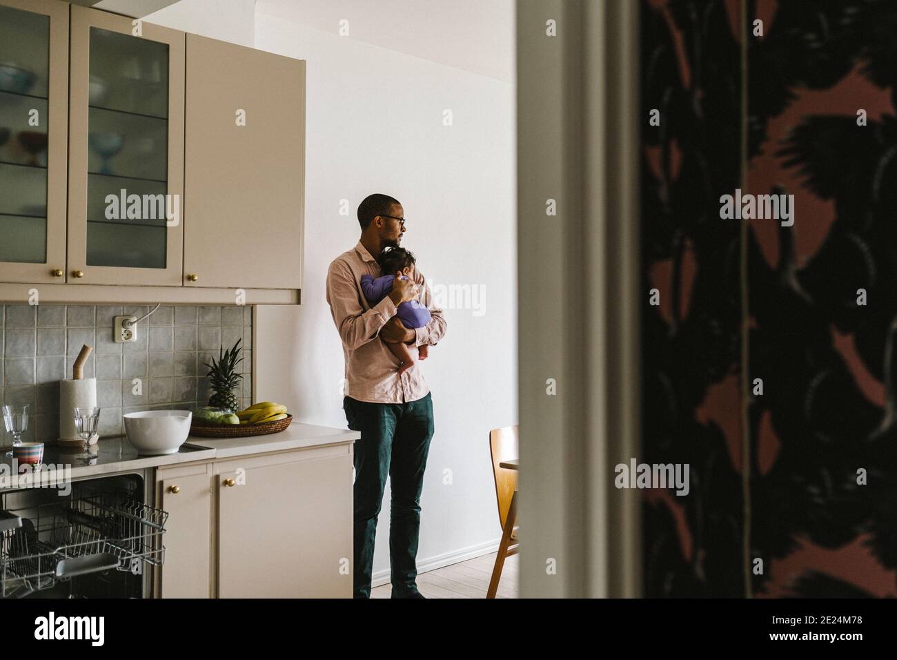 Father carrying baby Stock Photo - Alamy