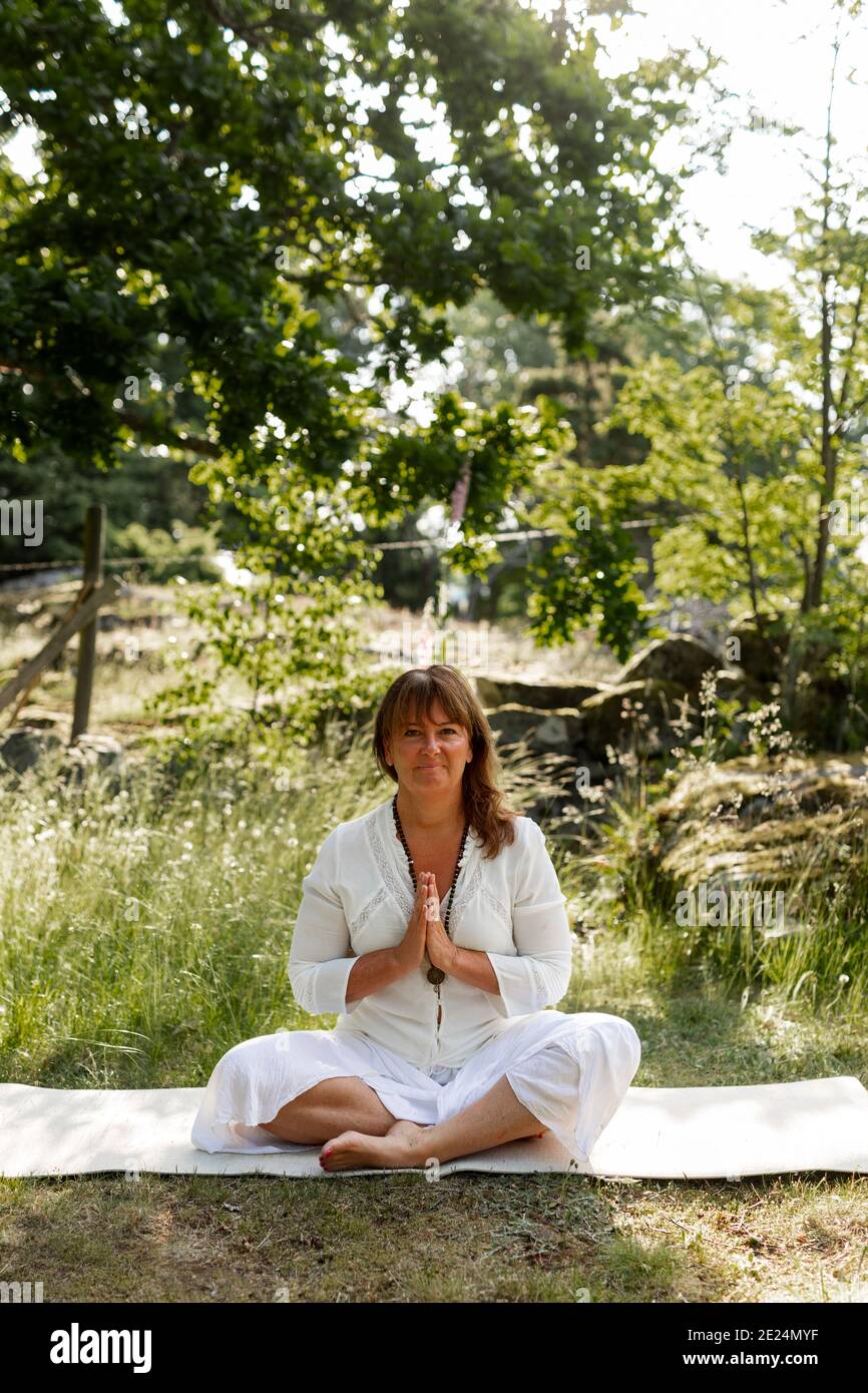 Woman meditating outdoor Stock Photo - Alamy