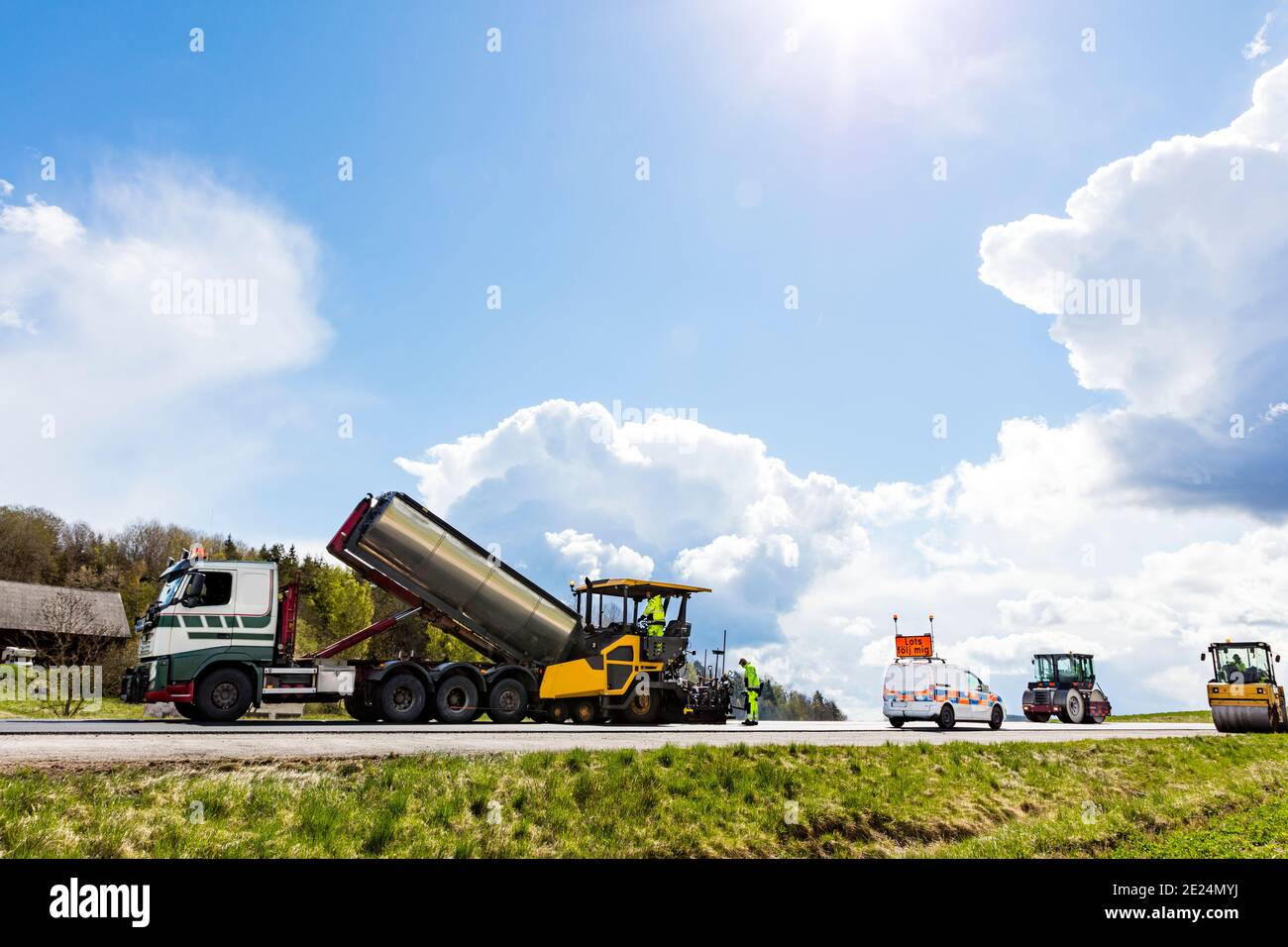 Roadwork vehicles at work Stock Photo - Alamy