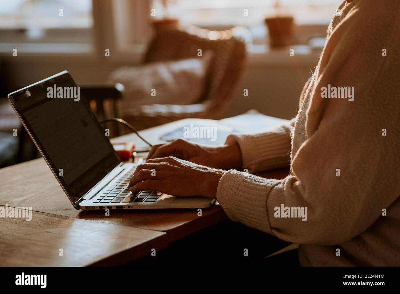 Woman using laptop at home Stock Photo - Alamy