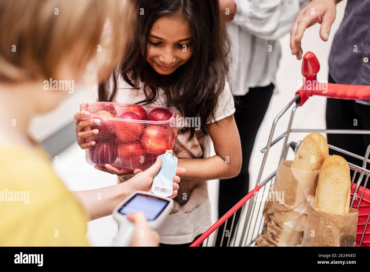 Girls using barcode reader in supermarket Stock Photo - Alamy
