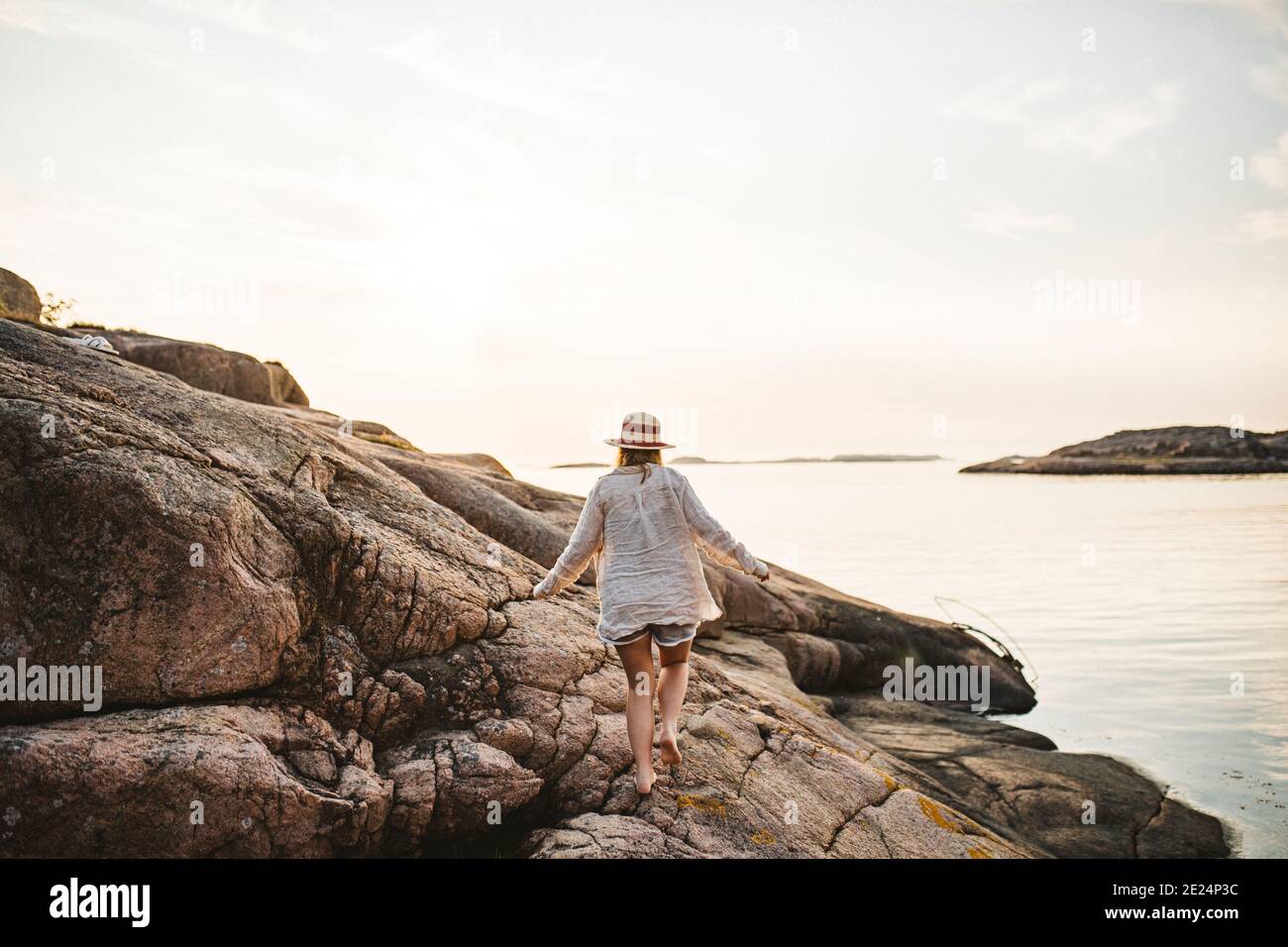 Woman walking at sea Stock Photo - Alamy