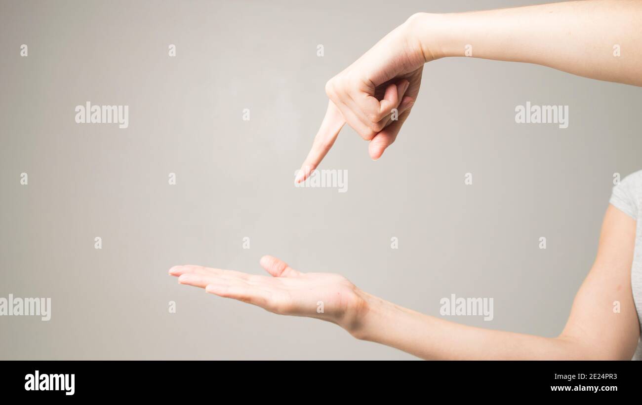young woman shows something Stock Photo - Alamy