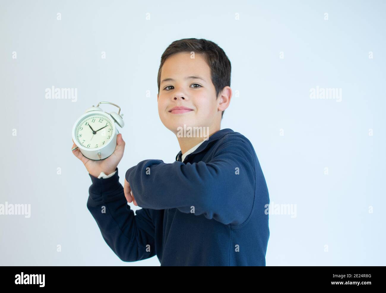 School boy showing alarm clock. Isolated on white background Stock ...