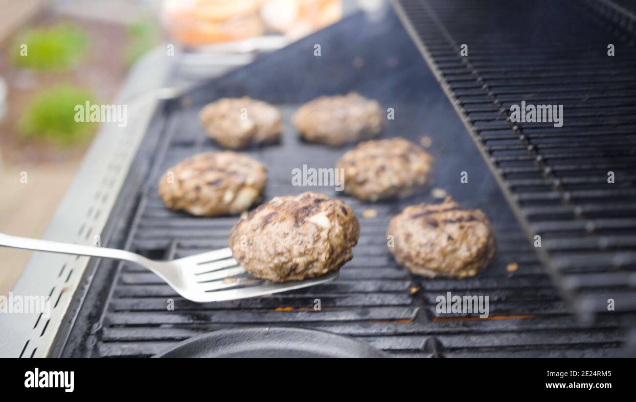 Cooking hamburger beef patties on a gas grill Stock Photo - Alamy