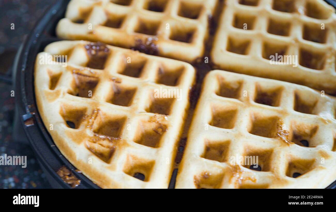 Making homemade waffles in an electric waffle maker Stock Photo - Alamy