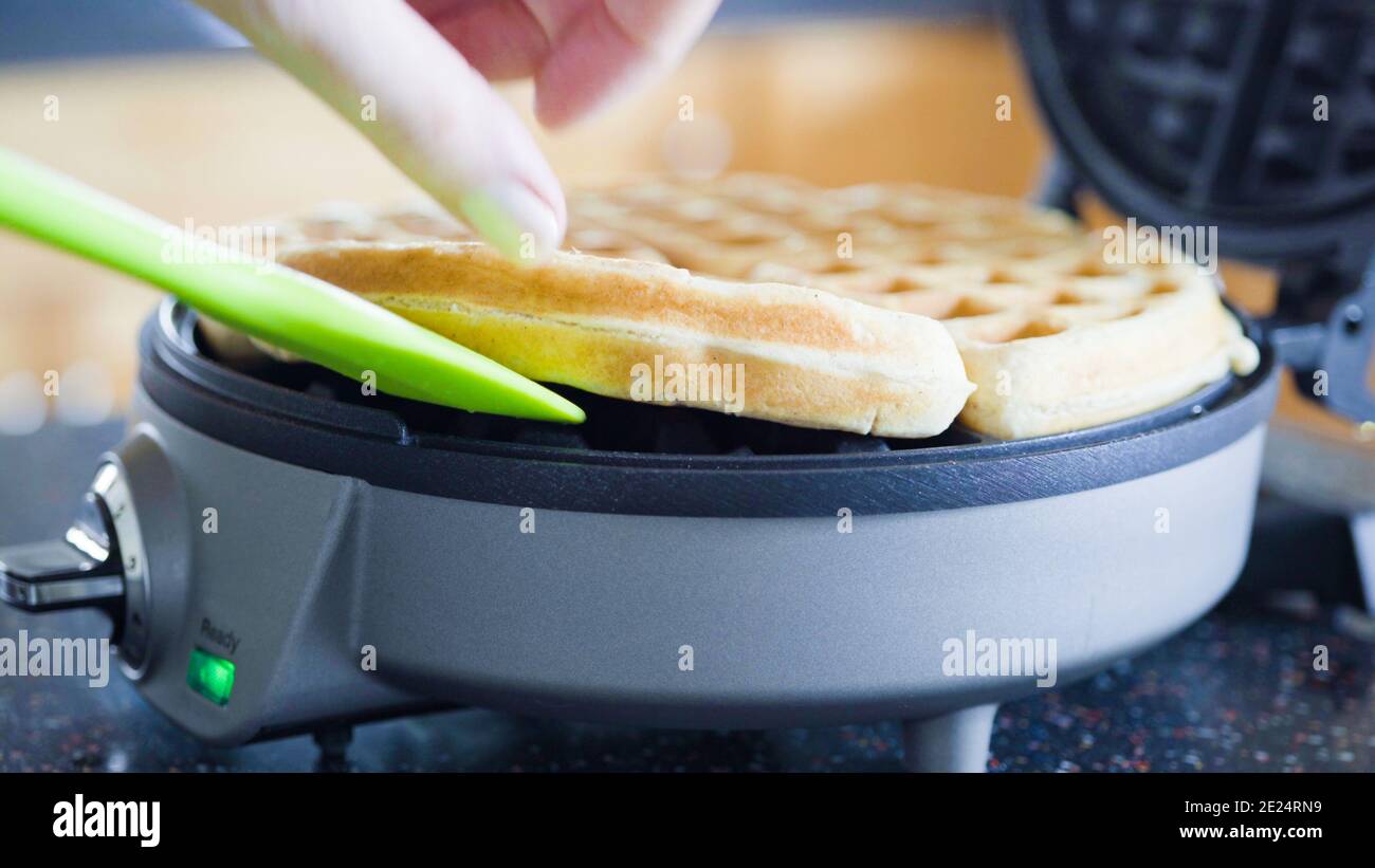 Making homemade waffles in an electric waffle maker Stock Photo - Alamy