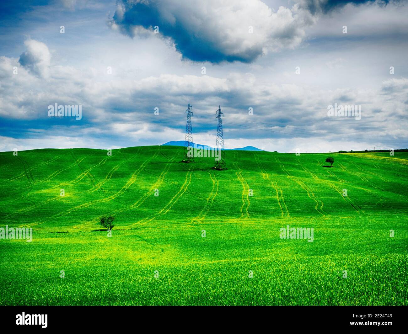 Power lines through rural landscape, Tuscany, Italy Stock Photo - Alamy