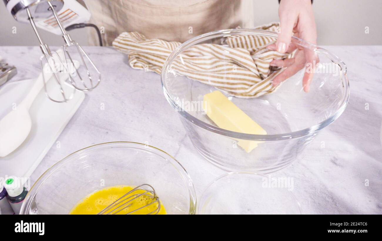 Step by step. Mixing ingredient in a mixing bowl with an electric mixer ...