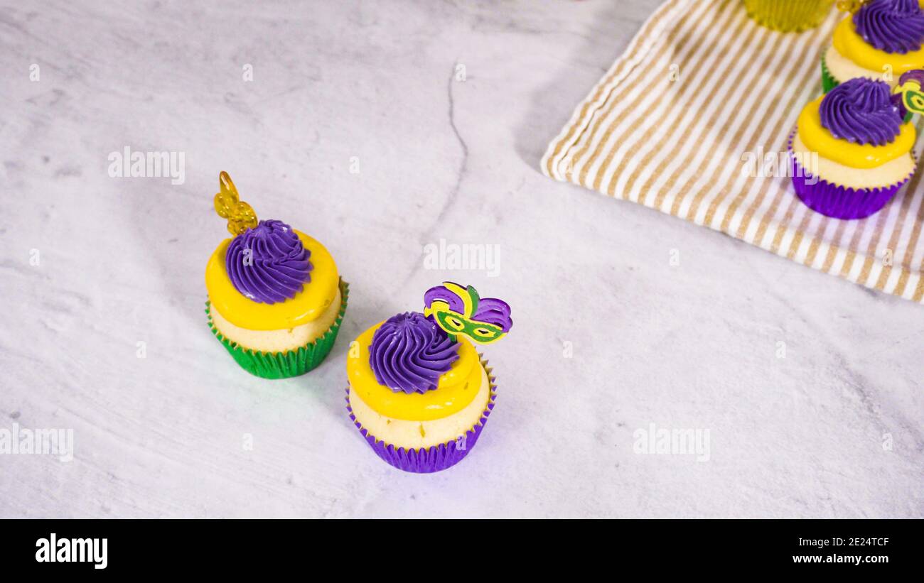 Frosting vanilla cupcakes italian buttercream hi-res stock photography ...