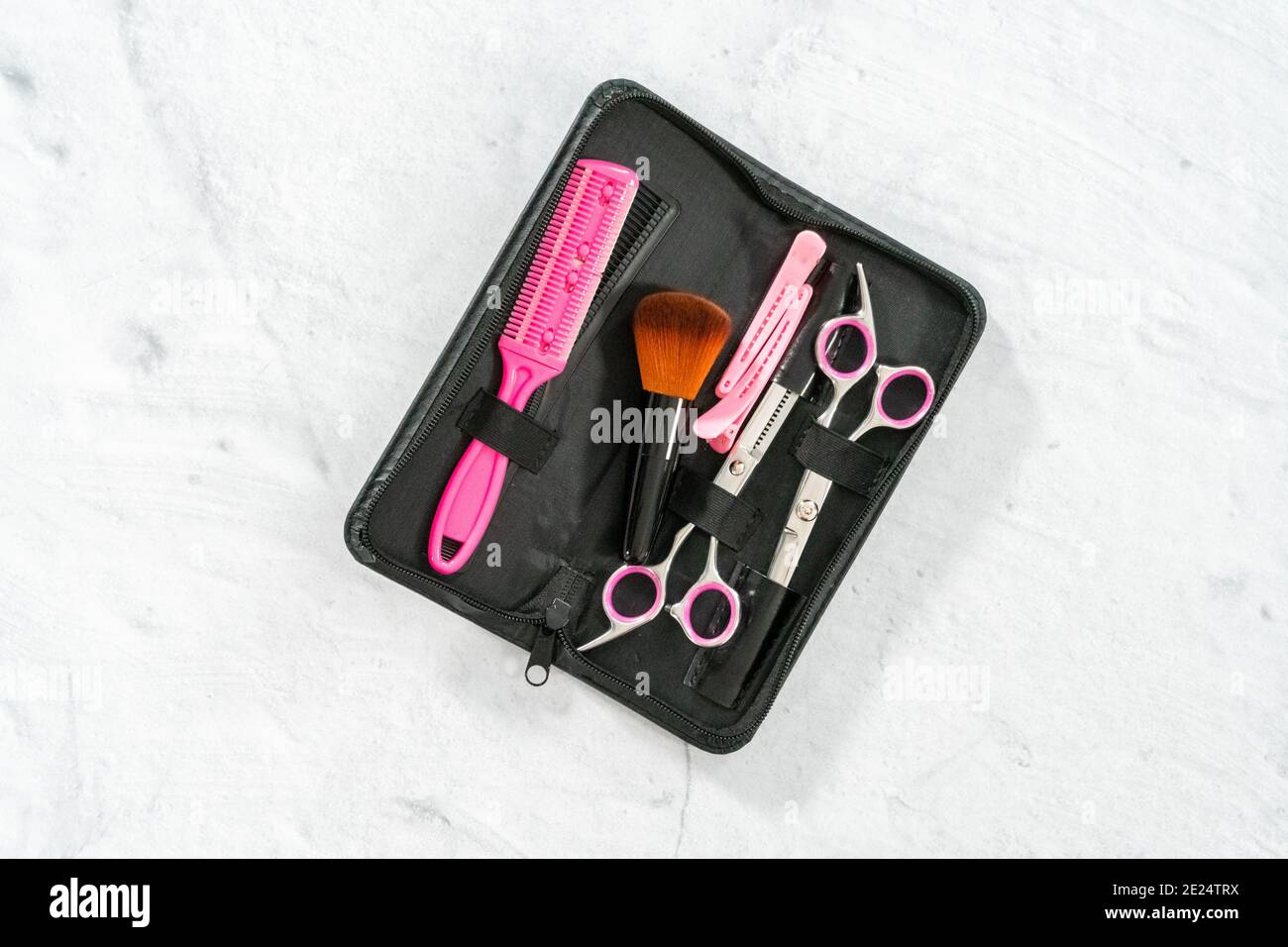 Flat lay. New barber set with pink scissors on a gray background Stock ...