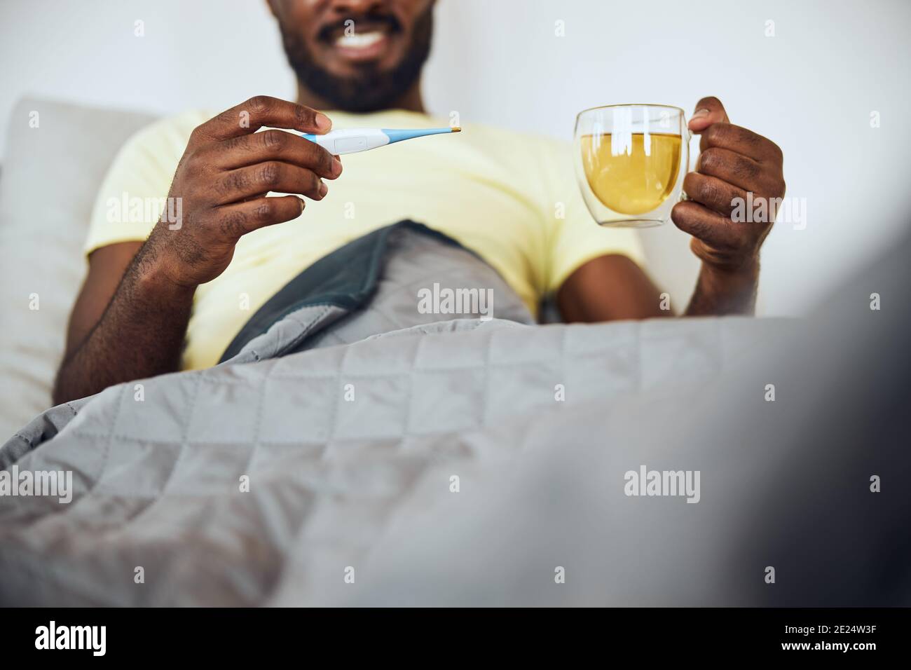 Adult man getting sick and measuring the temperature Stock Photo - Alamy