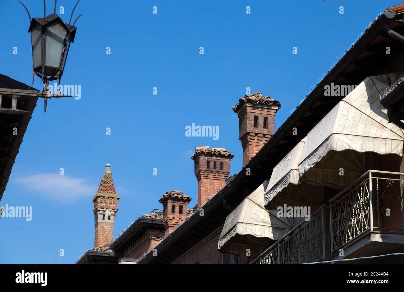 Row of different stone chimneys on the roof of an Italian house, Italy ...