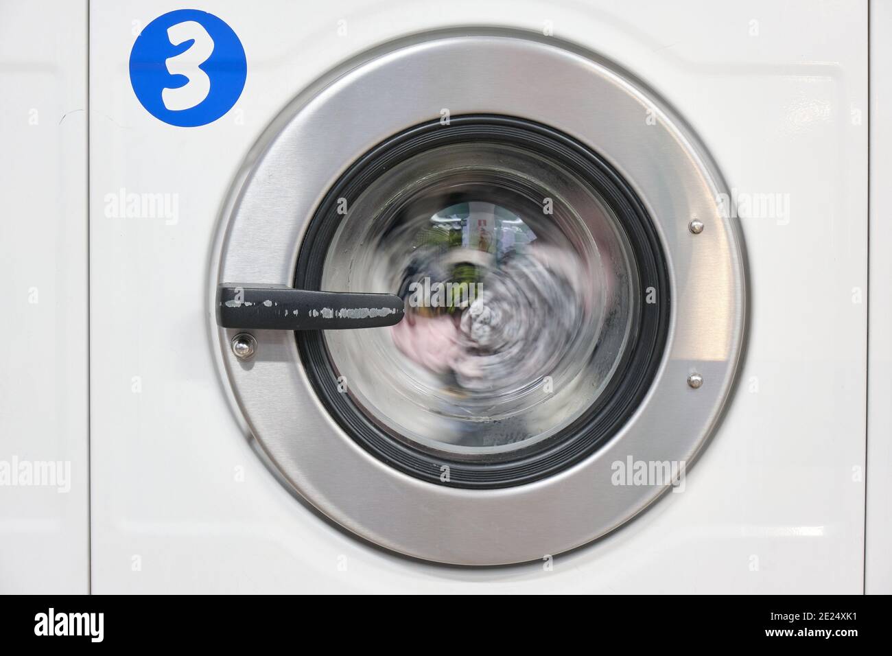 White Washing Machine At laundry front view Stock Photo - Alamy