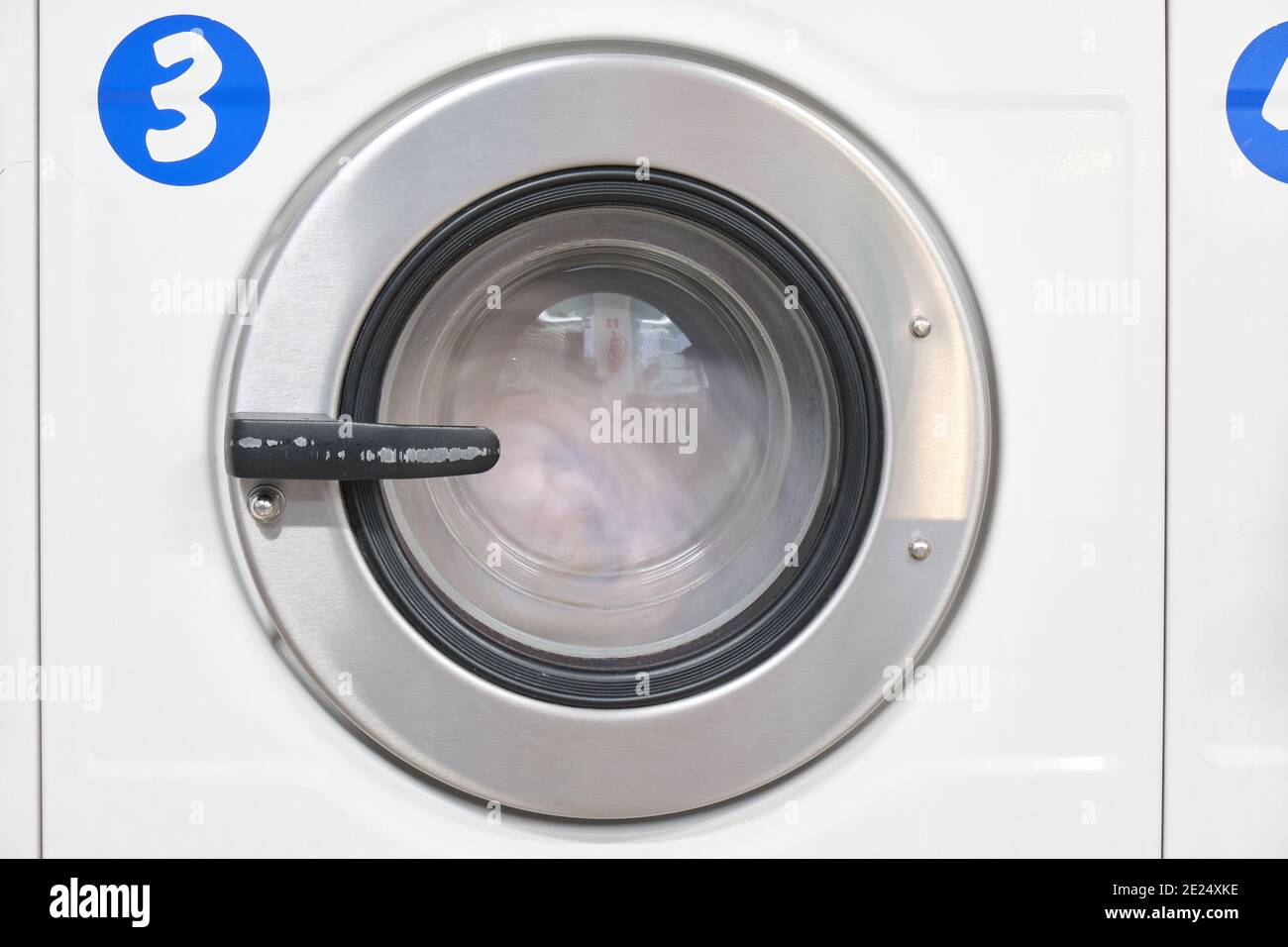 White Washing Machine At laundry front view Stock Photo - Alamy