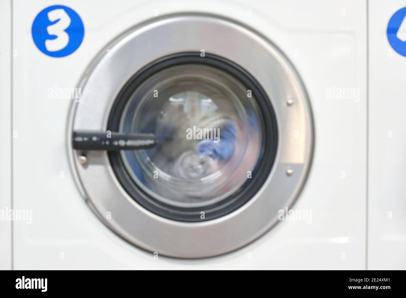White Washing Machine At laundry front view Stock Photo - Alamy