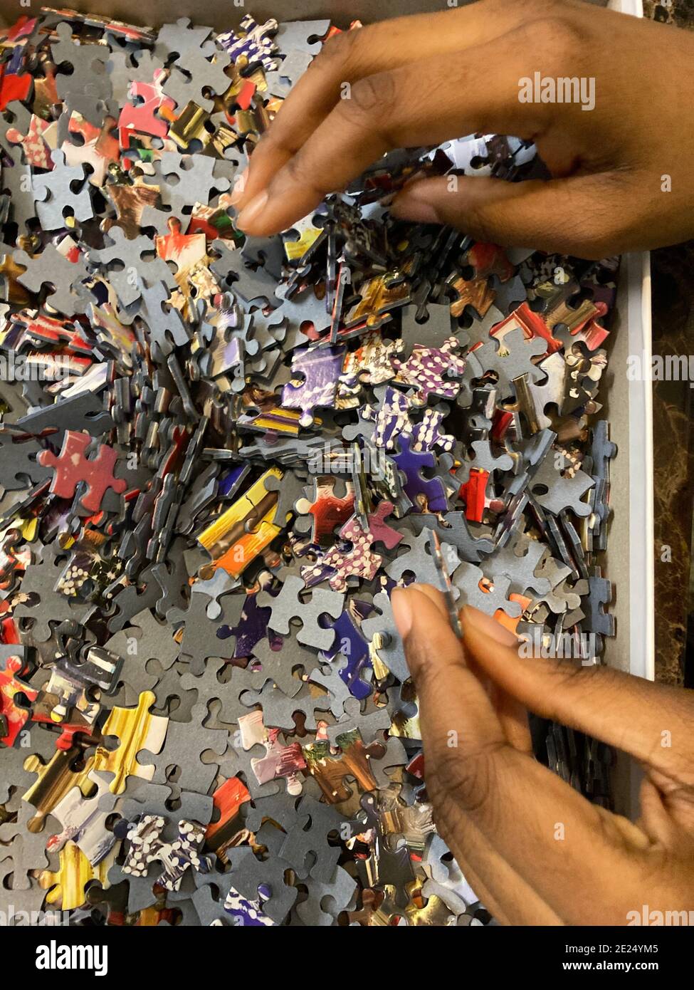 Pile of jigsaw puzzle pieces Stock Photo - Alamy