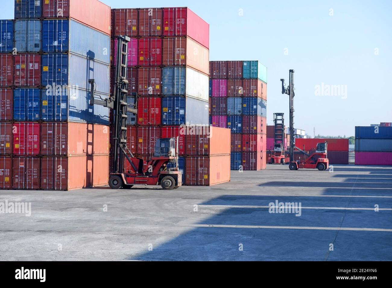 Container handlers Perspective of import and export Stock Photo - Alamy