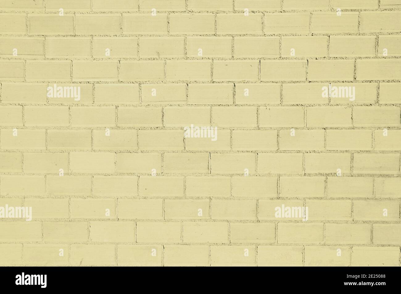 Yellow painted bricks wall background Stock Photo - Alamy
