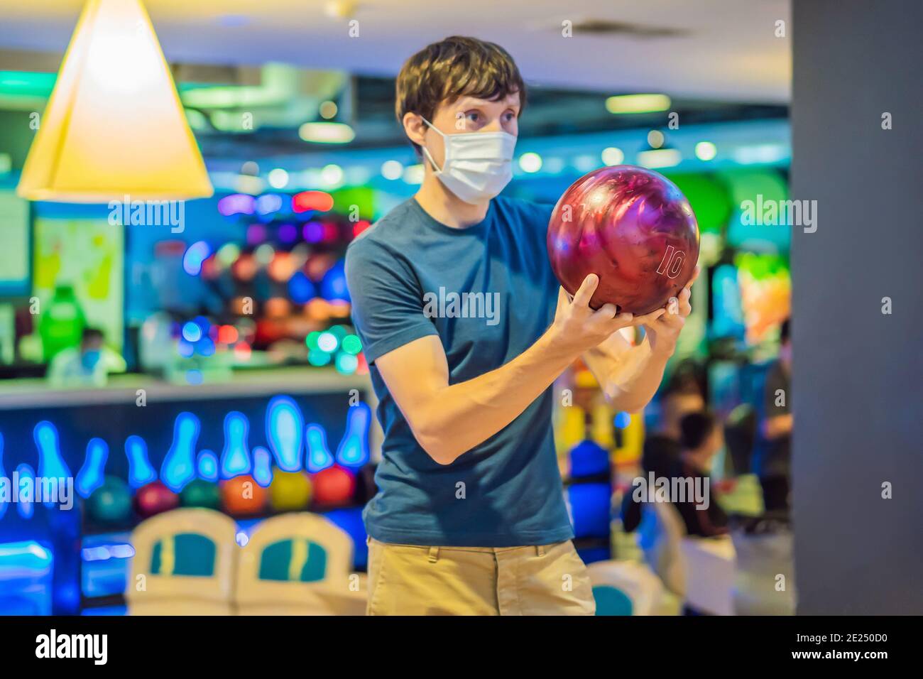 Man playing bowling with medical masks during COVID-19 coronavirus in ...