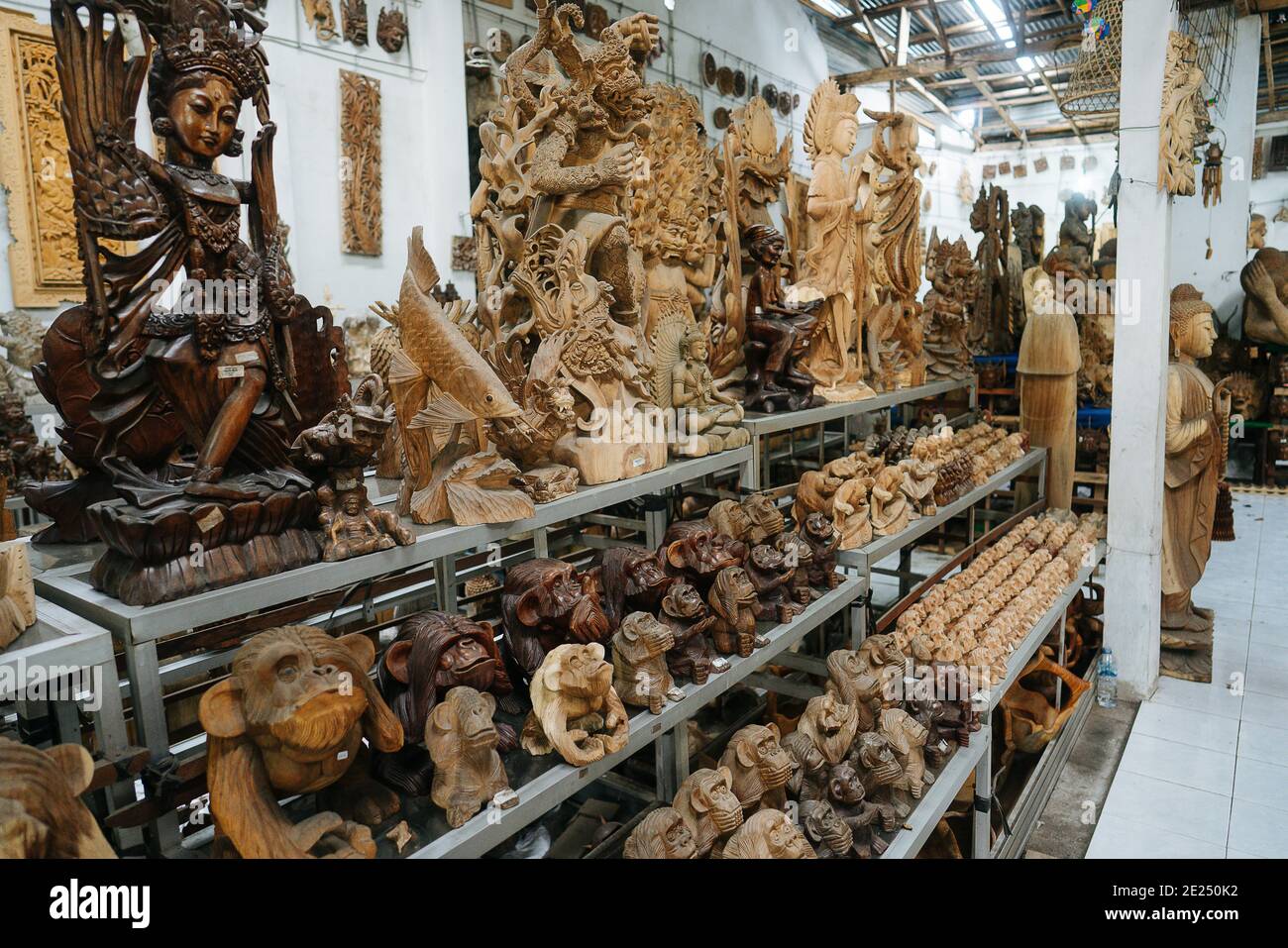 BALI, INDONESIA - FEBRUARY 12, 2020 Wooden figurines in a souvenir shop ...