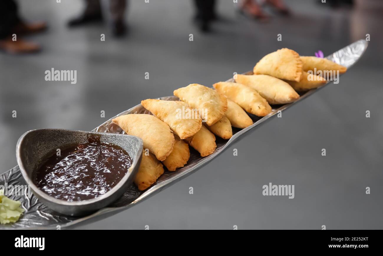 Long metallic tray with Samosa snacks at a corporate event Stock Photo ...