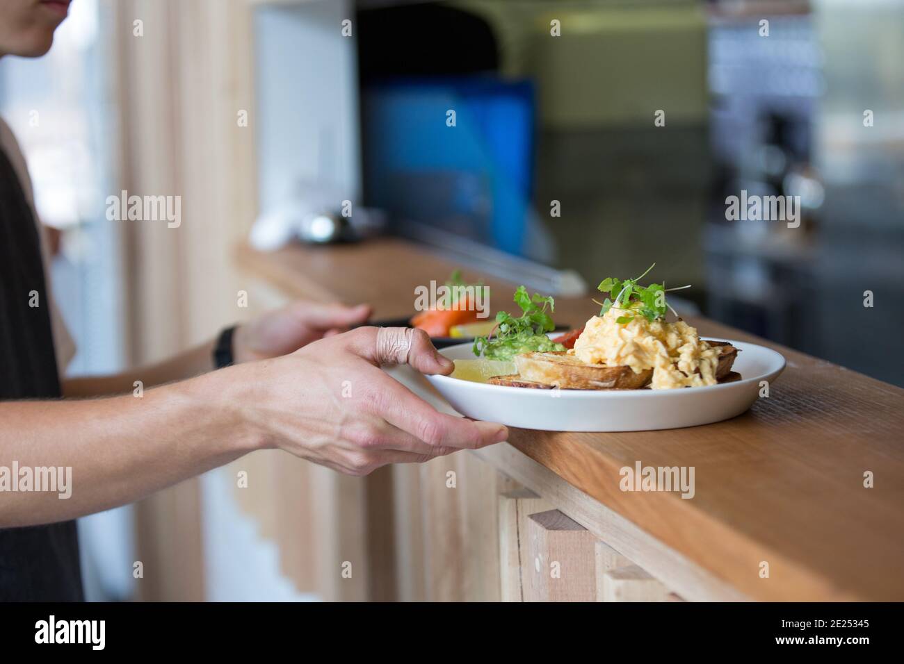 View of waiter service healthy food at a restauran Stock Photo - Alamy