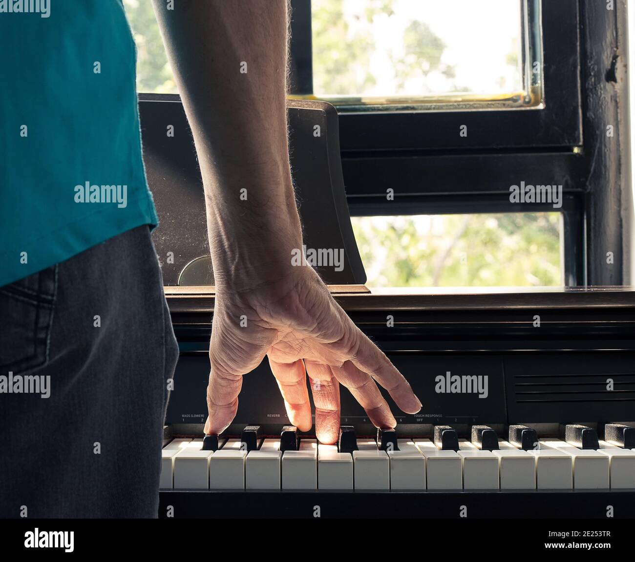 Man practicing piano home hi-res stock photography and images - Alamy