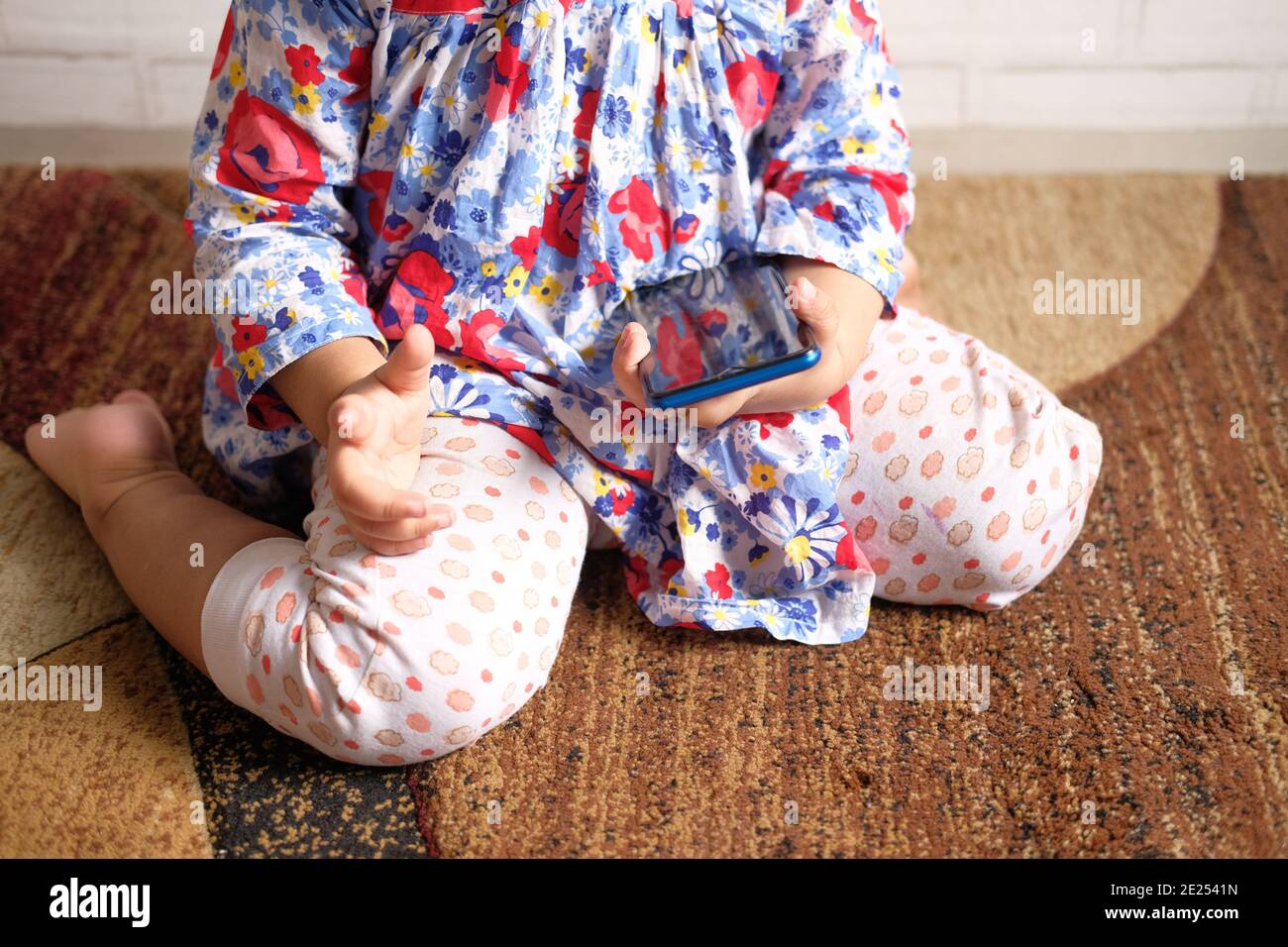 Child girl watching cartoon on smart phone Stock Photo - Alamy