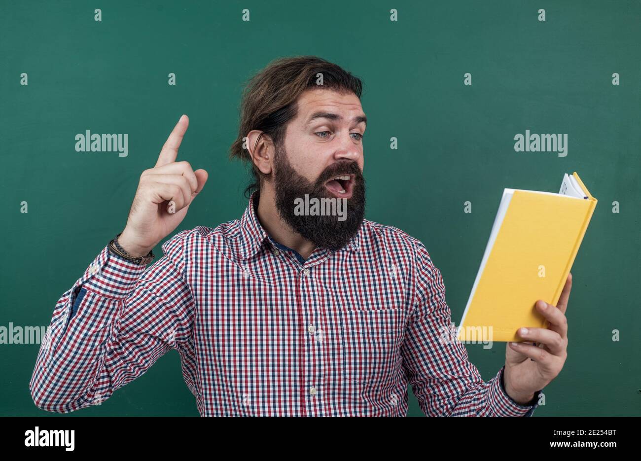 informal education. male student sit in classroom while lesson. pass ...