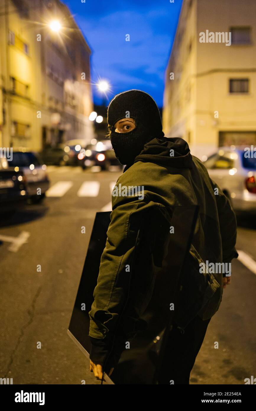Thief sneaking away hi-res stock photography and images - Alamy