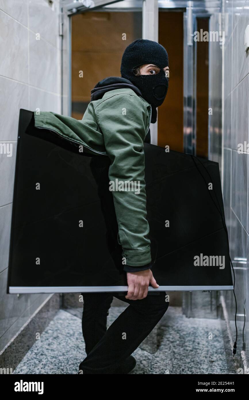 Escaping thief hi-res stock photography and images - Alamy