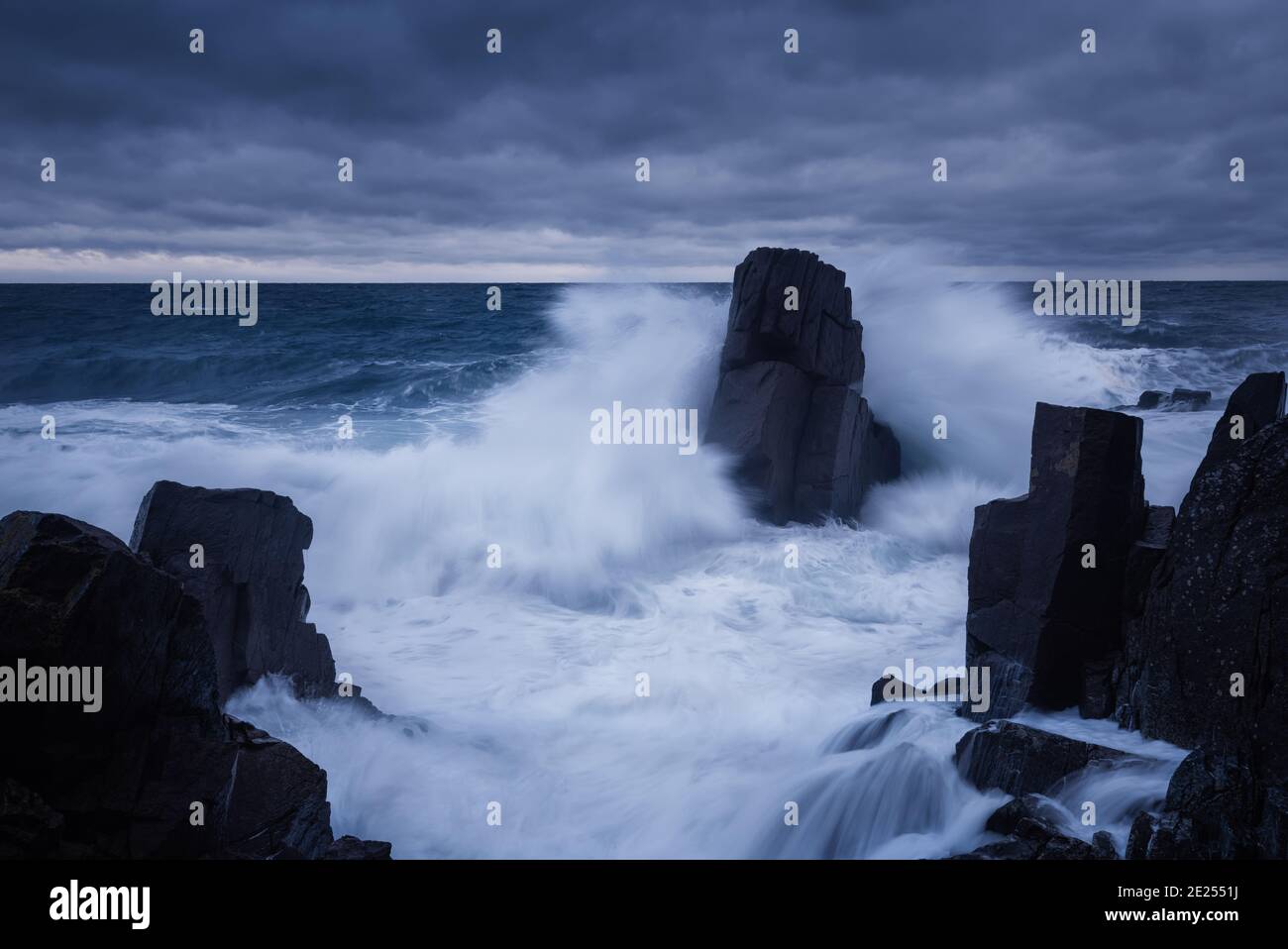 Dramatic nature background - big waves and dark rock in stormy sea ...