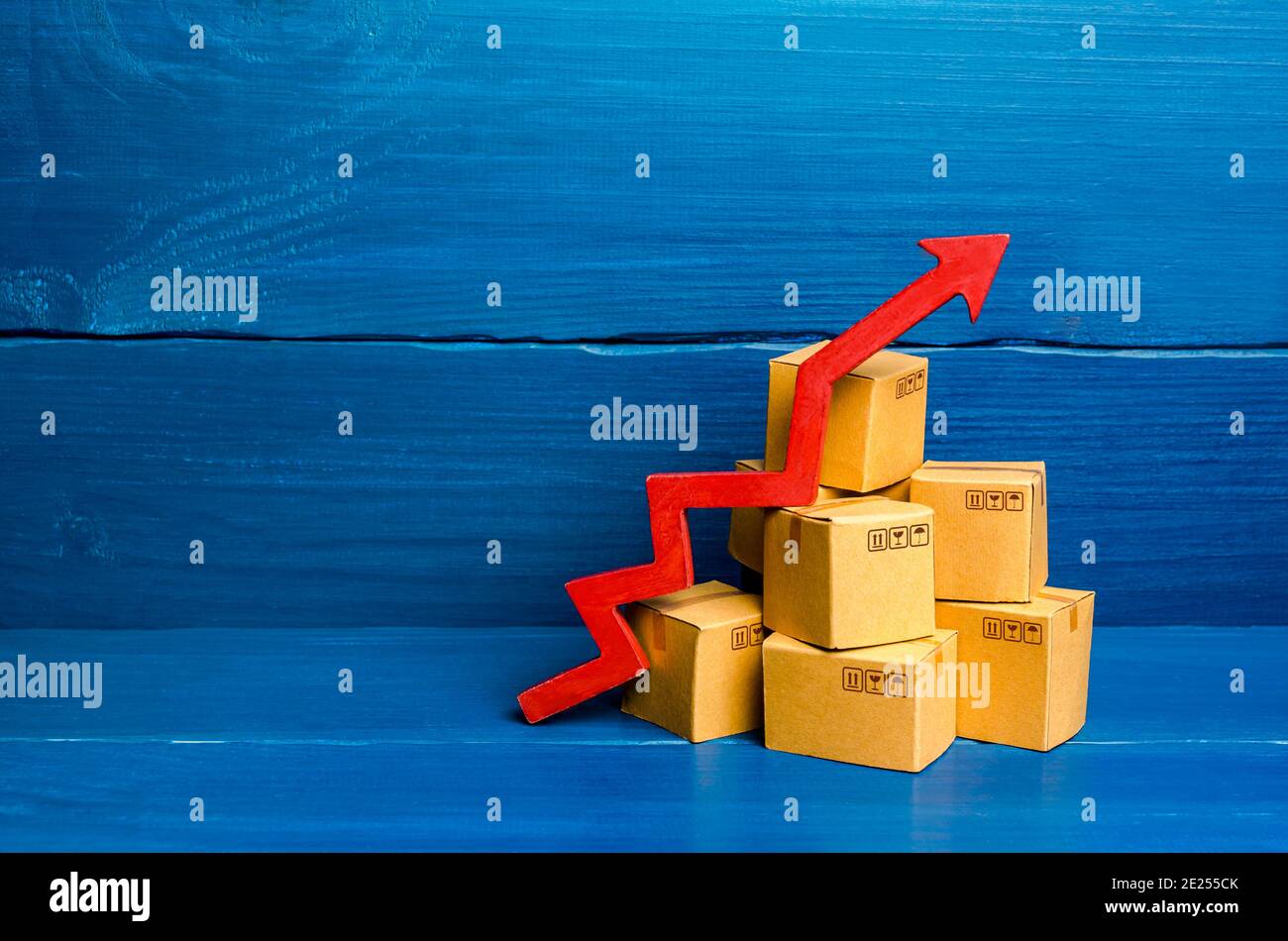 Cardboard boxes and red arrow up. Transformation of the economy and ...