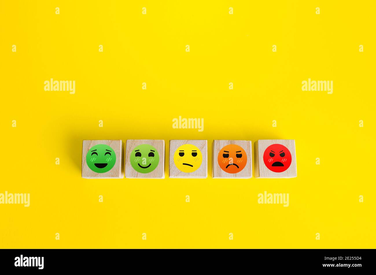 Mood faces from happy to angry on wooden blocks. Concept of rating ...