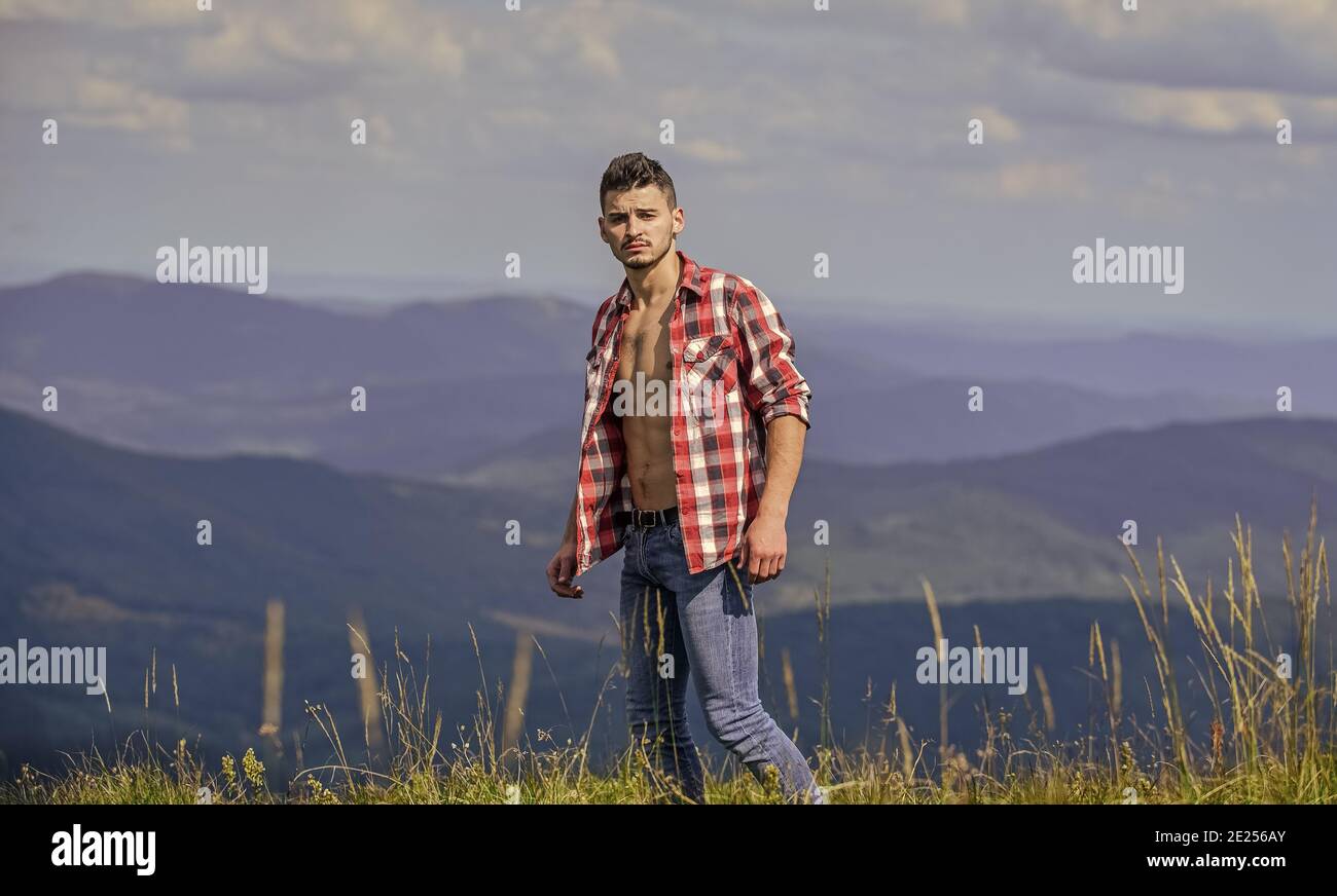 Strong hiker muscular torso. Athlete muscular guy relax mountains ...