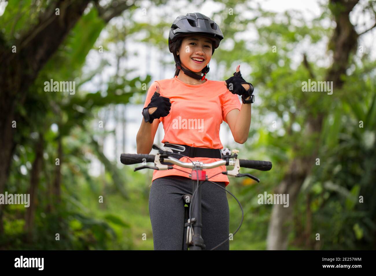 Gorgeous strong young asian woman cyclist Stock Photo - Alamy
