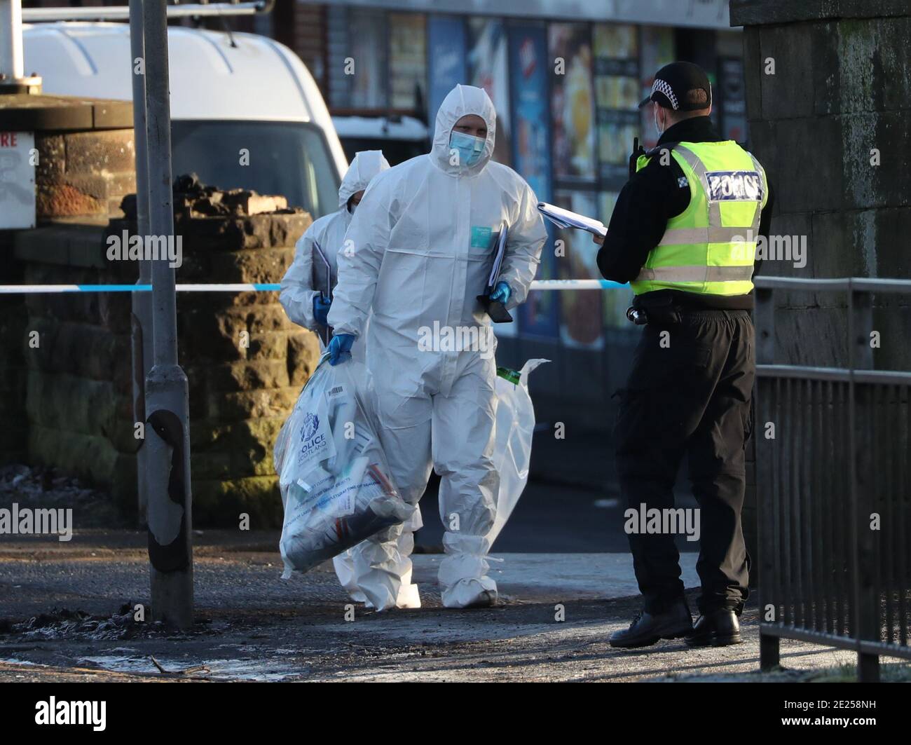 Forensic officers remove evidence hi-res stock photography and images ...