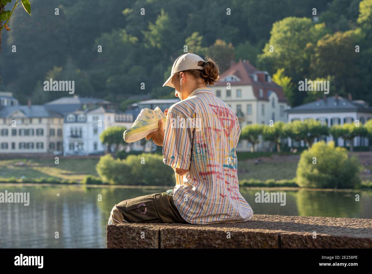 Heidelberg, Germany - Aug 1, 2020: Artist paint grafitti on shoe on ...