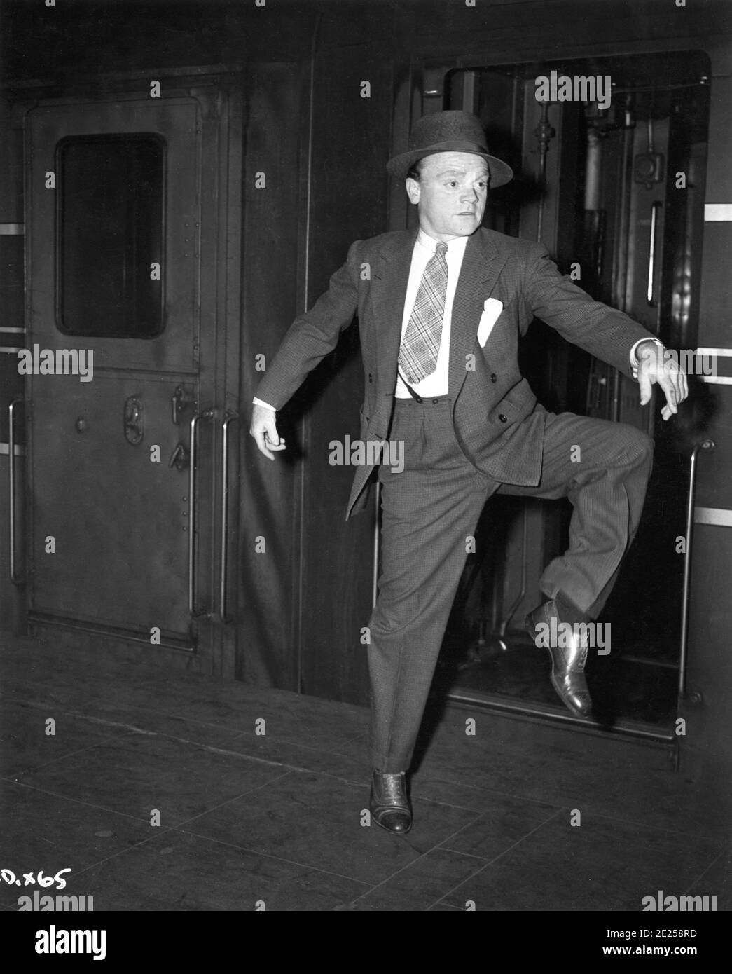 JAMES CAGNEY poses for the Press on arrival by train in New York on ...
