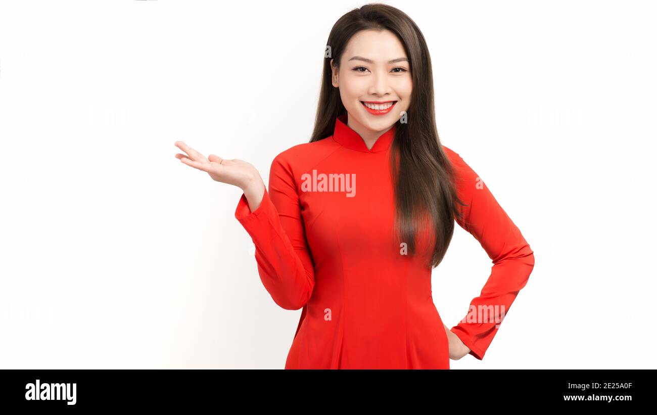 young asian woman in red ao dai with gesture in Lunar new year Stock ...