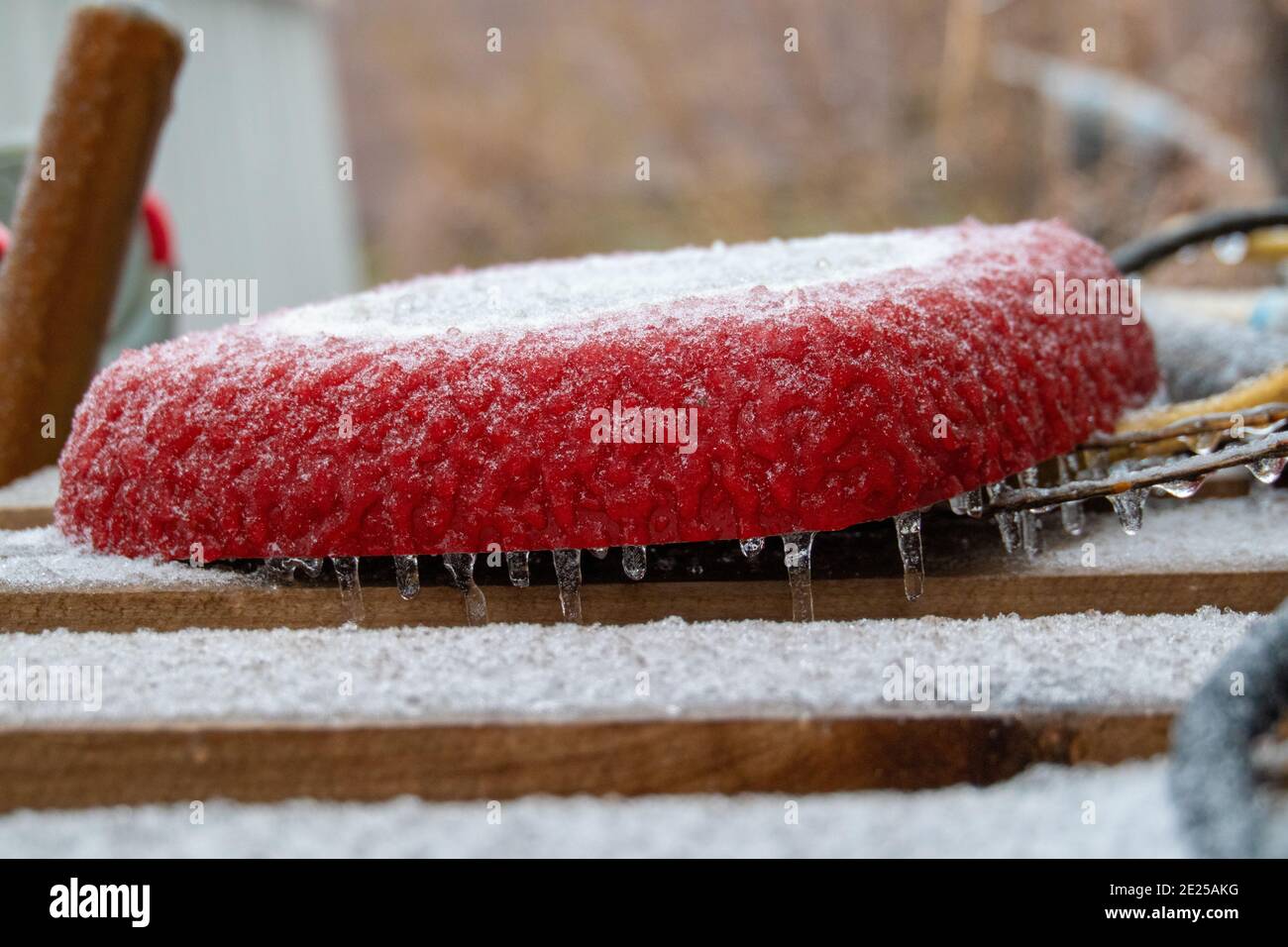 Frying pan frozen in ice outside Stock Photo - Alamy