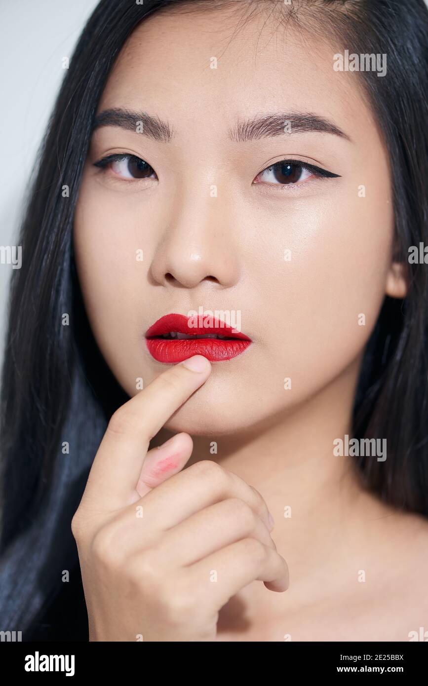 Hand touching lips hi-res stock photography and images - Alamy