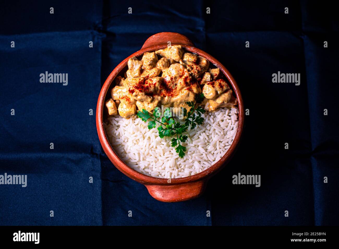 Top view of traditional Indian spicy lamb food with basmati rice in a ...