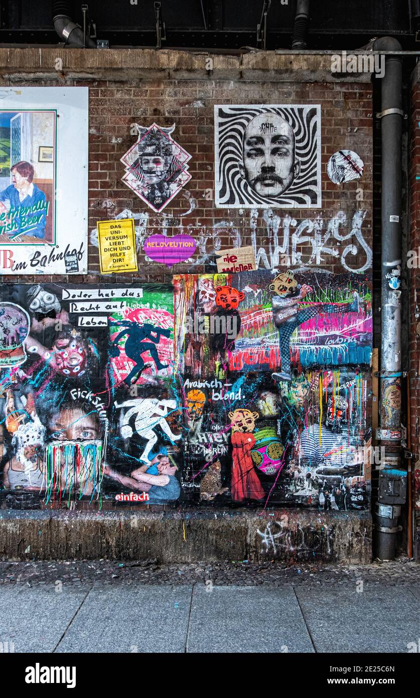 Brick wall under railway viaduct covered with graffiti, street art ...