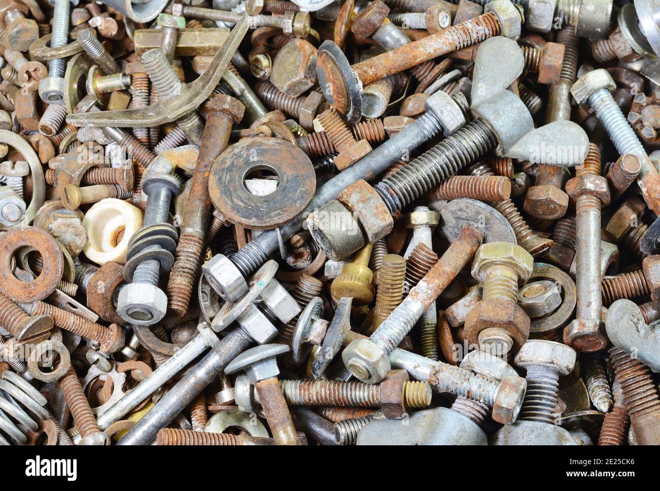 Background from old rusty bolts, screws, nuts, screws, brackets ...