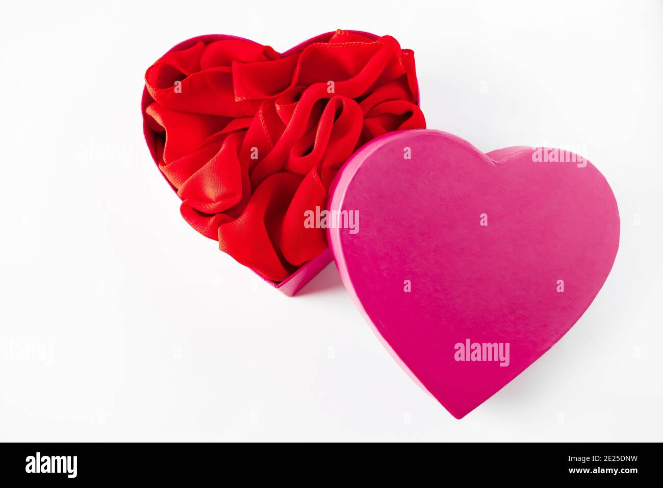 Pink heart shaped open gift box on white background Stock Photo - Alamy